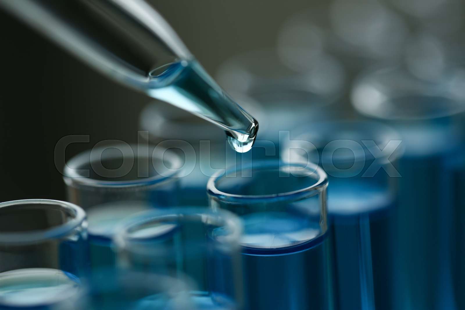 Test tube of glass overflows liquid solution potassium | Stock image ...