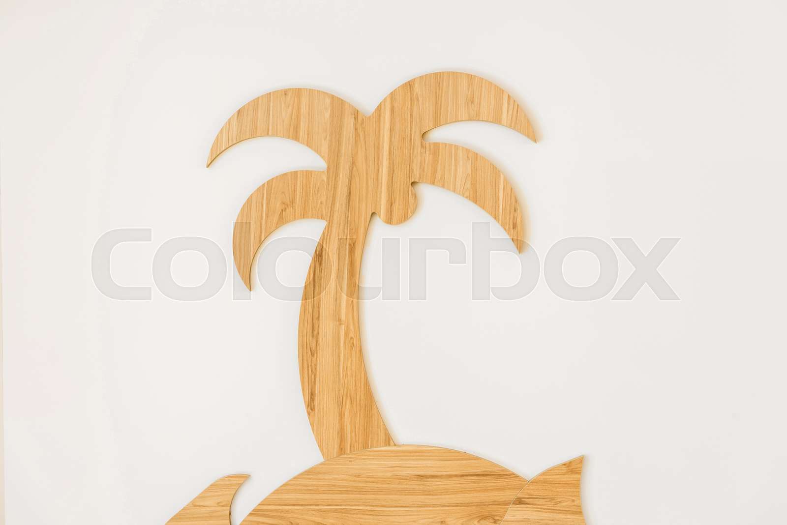 close-up view of decorative handmade wooden palm tree isolated on white ...
