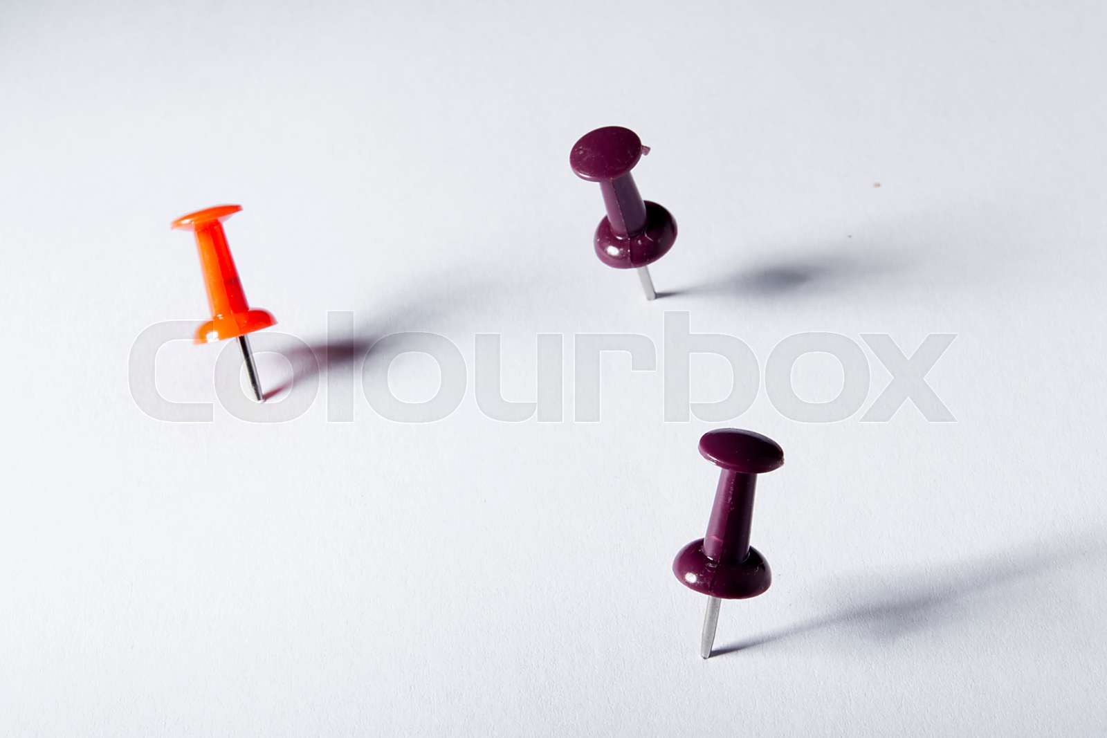 Pins stuck into the paper | Stock image | Colourbox