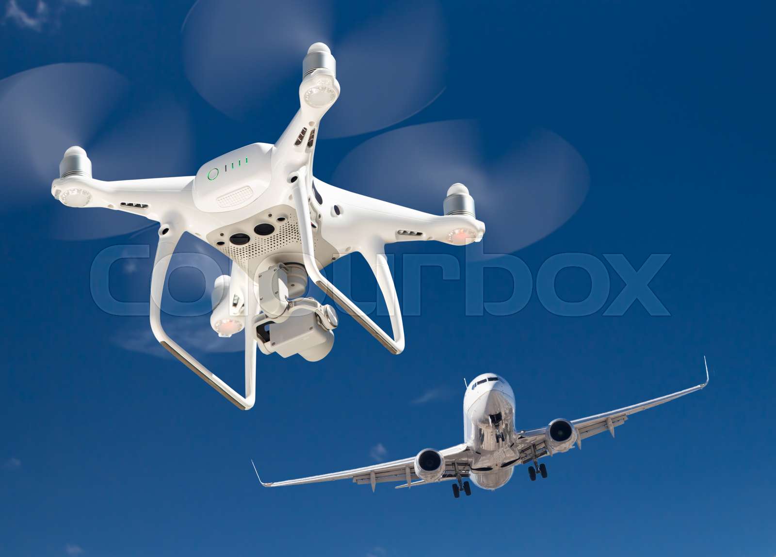 Unmanned Aircraft System (UAV) Quadcopter Drone In The Air Too Close To ...