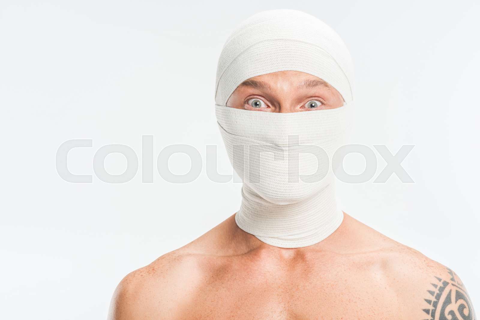 close up of man face covered with white bandages after plastic surgery ...