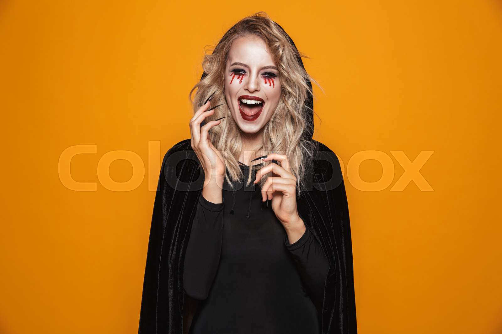Happy scary woman witch looking camera isolated | Stock image | Colourbox