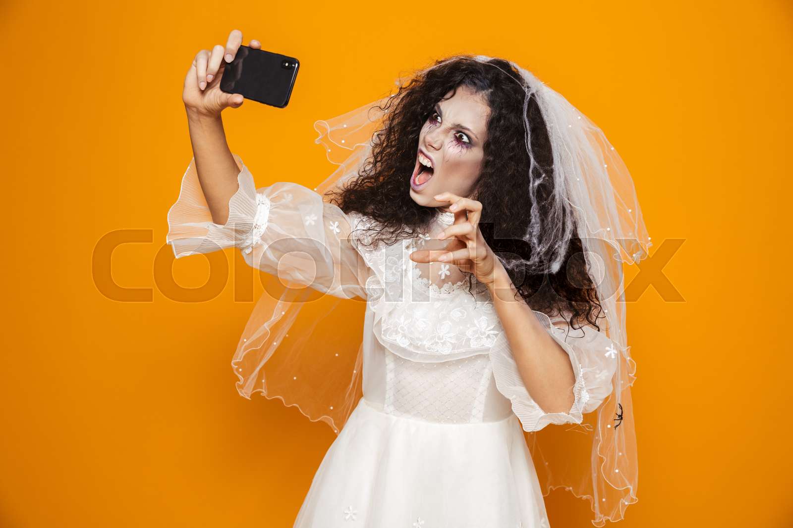 Scary creepy bride making selfie isolated | Stock image | Colourbox