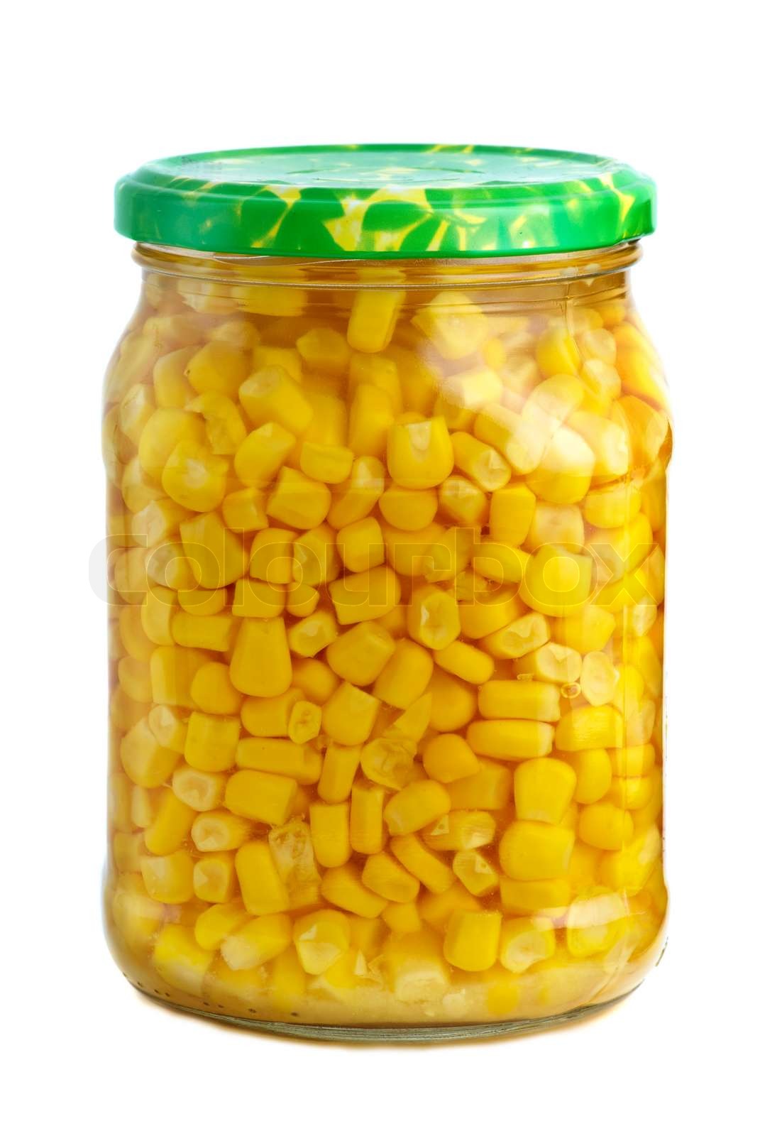 Glass jar with marinated corn grains | Stock image | Colourbox