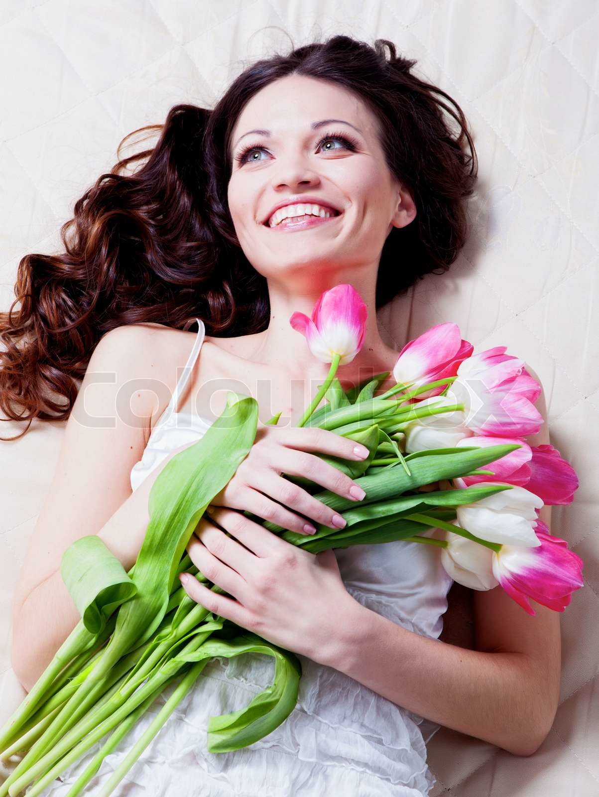 Girl with tulip flowers | Stock image | Colourbox