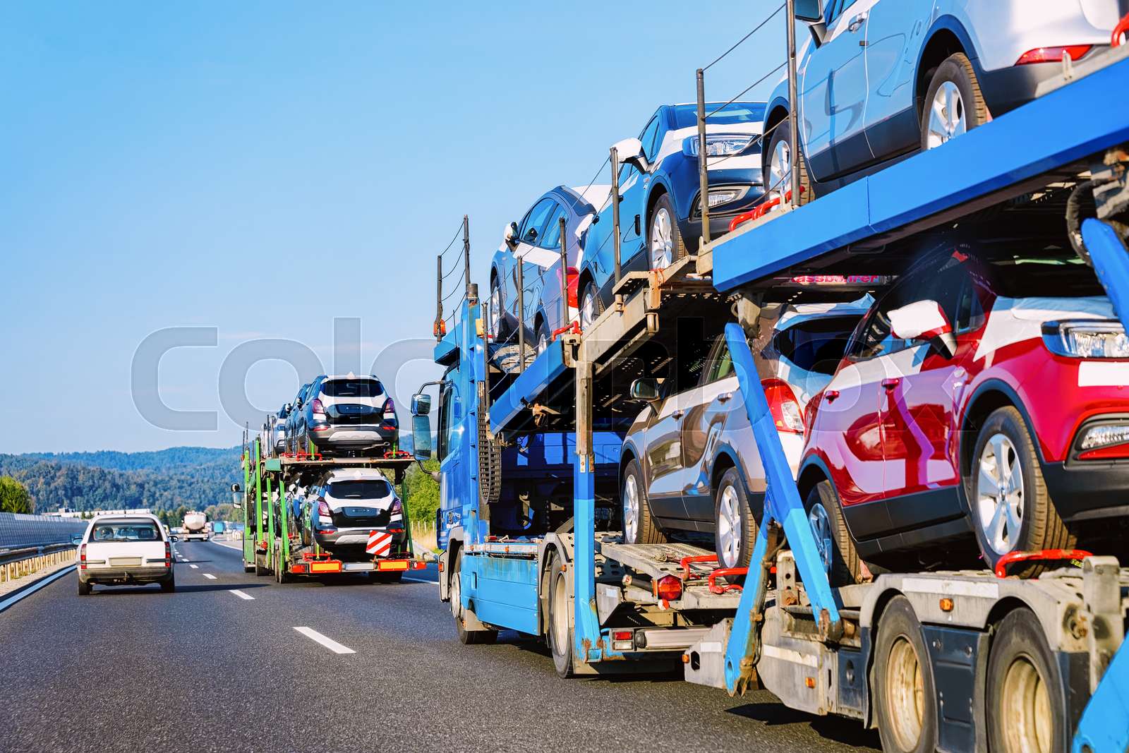 Cars carrier truck on asphalt highway road Poland | Stock image | Colourbox