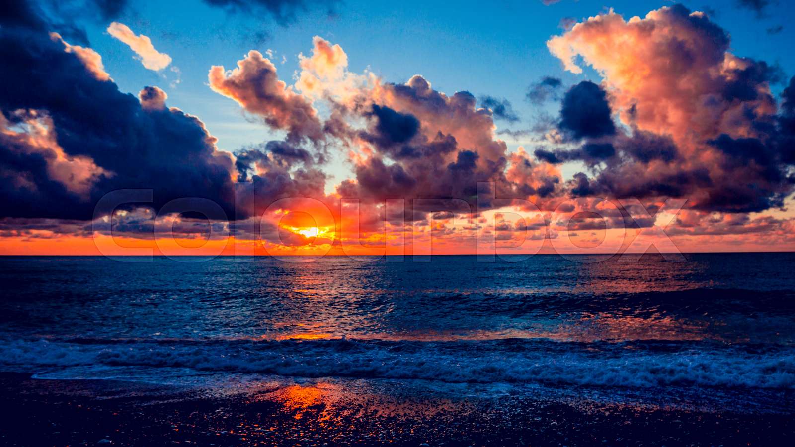Colorful sunset over ocean | Stock image | Colourbox