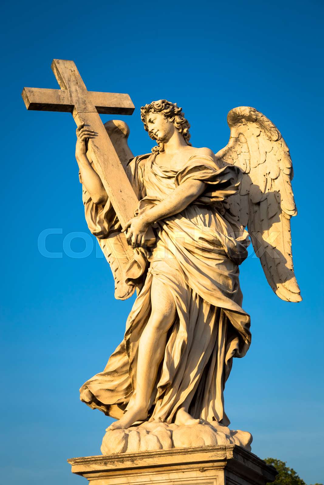 Catholic angel with cross | Stock image | Colourbox