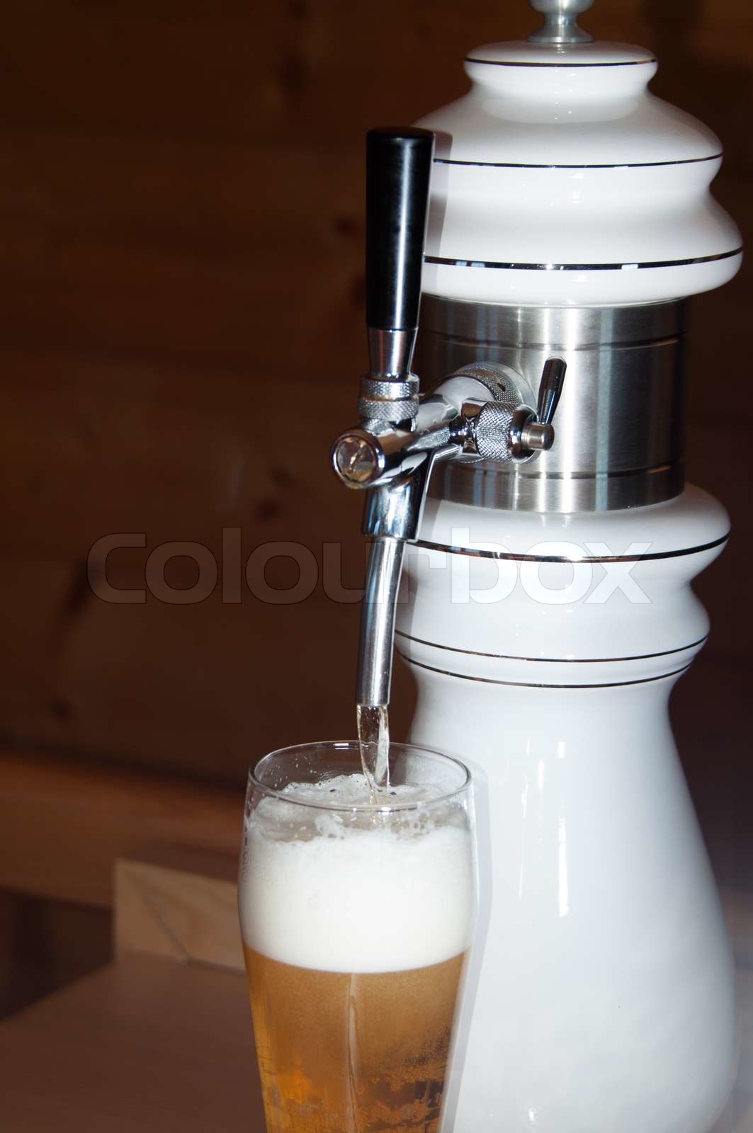 beer pouring from a tap | Stock image | Colourbox