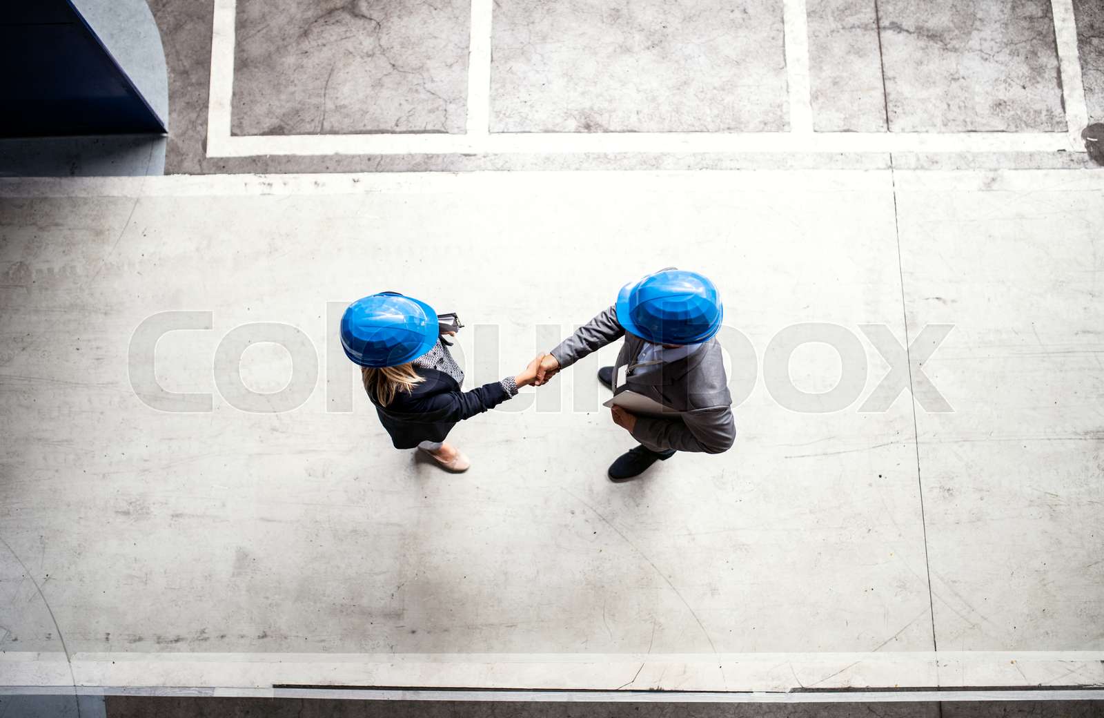 A top view of an industrial man and woman engineer in a factory ...