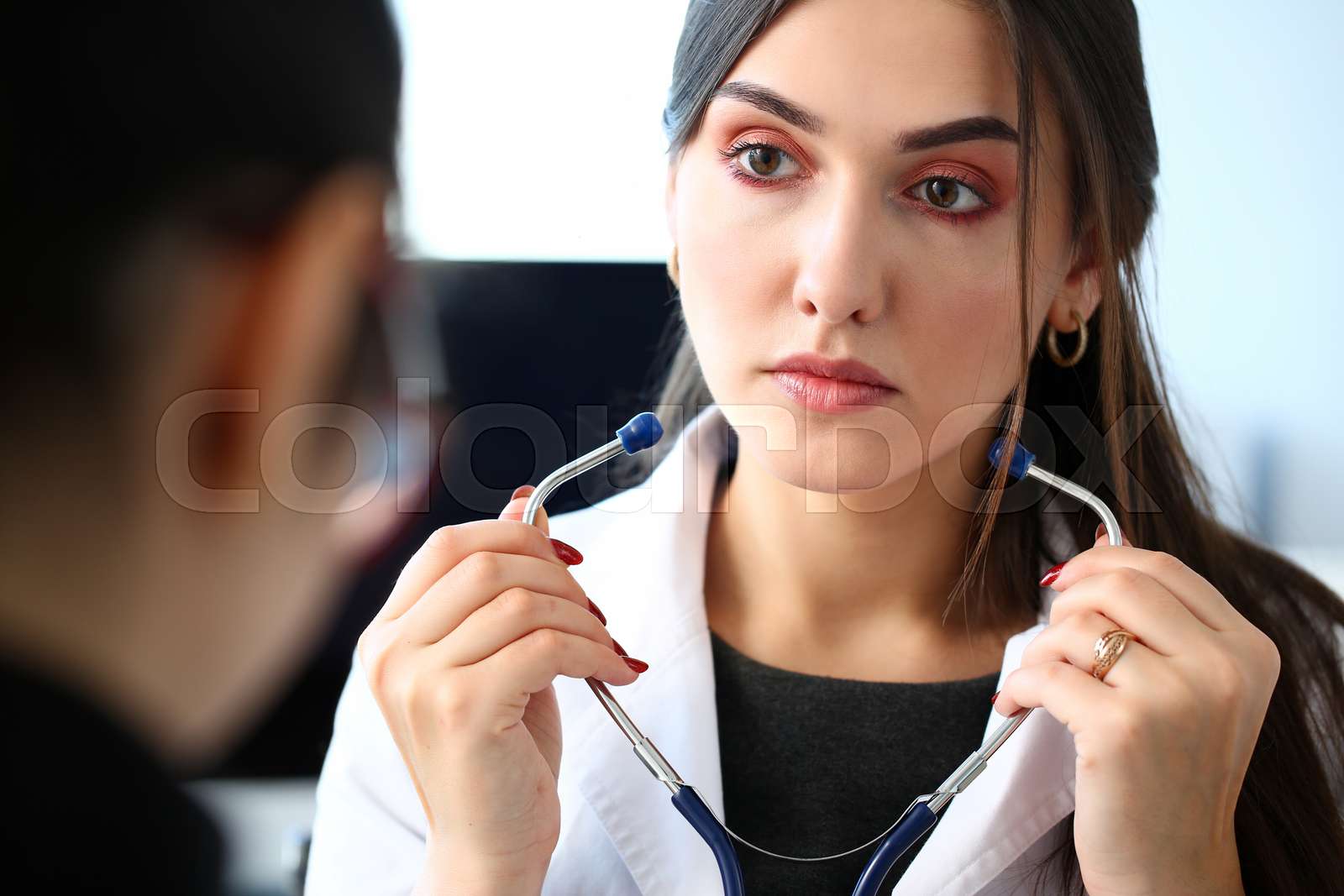 Female doctor hands holding stethoscope in | Stock image | Colourbox