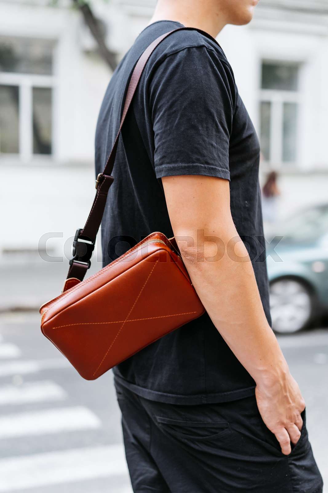 Guy with a hand bag on his shoulder | Stock image | Colourbox