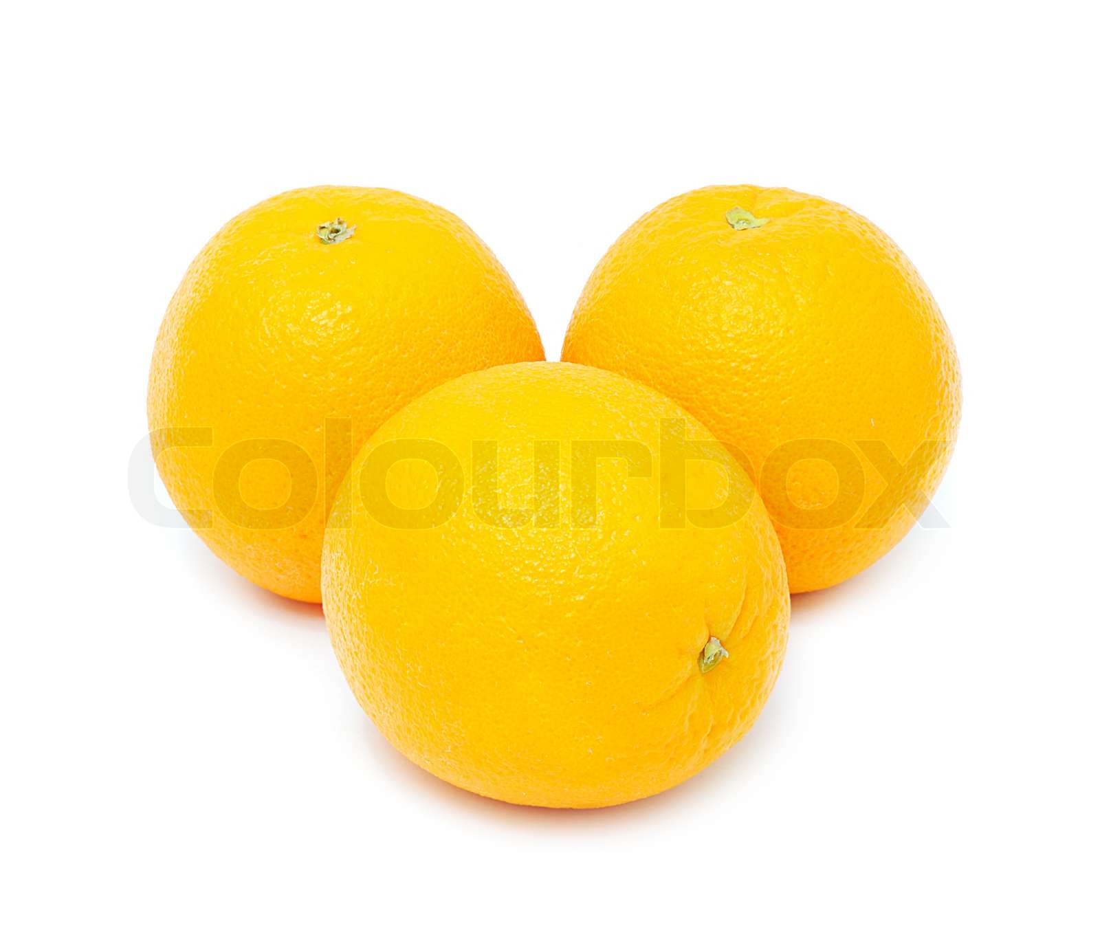 Drei saftige Orangen auf einem weißen Hintergrund | Stock Bild | Colourbox