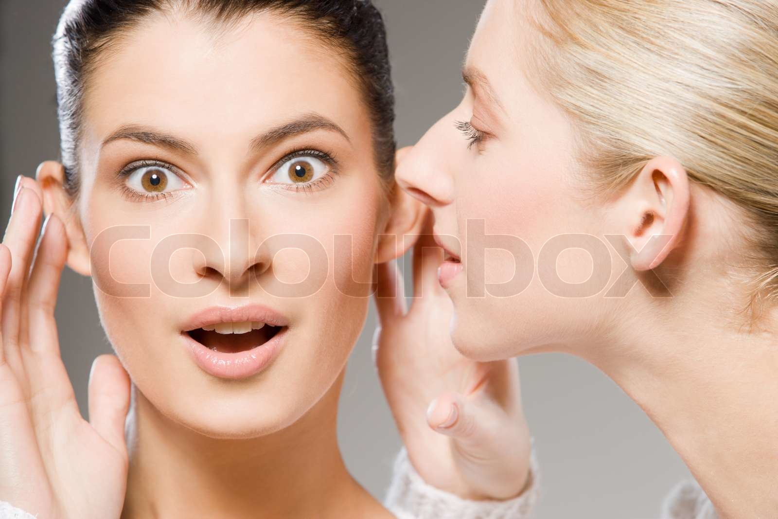 sharing secrets | Stock image | Colourbox