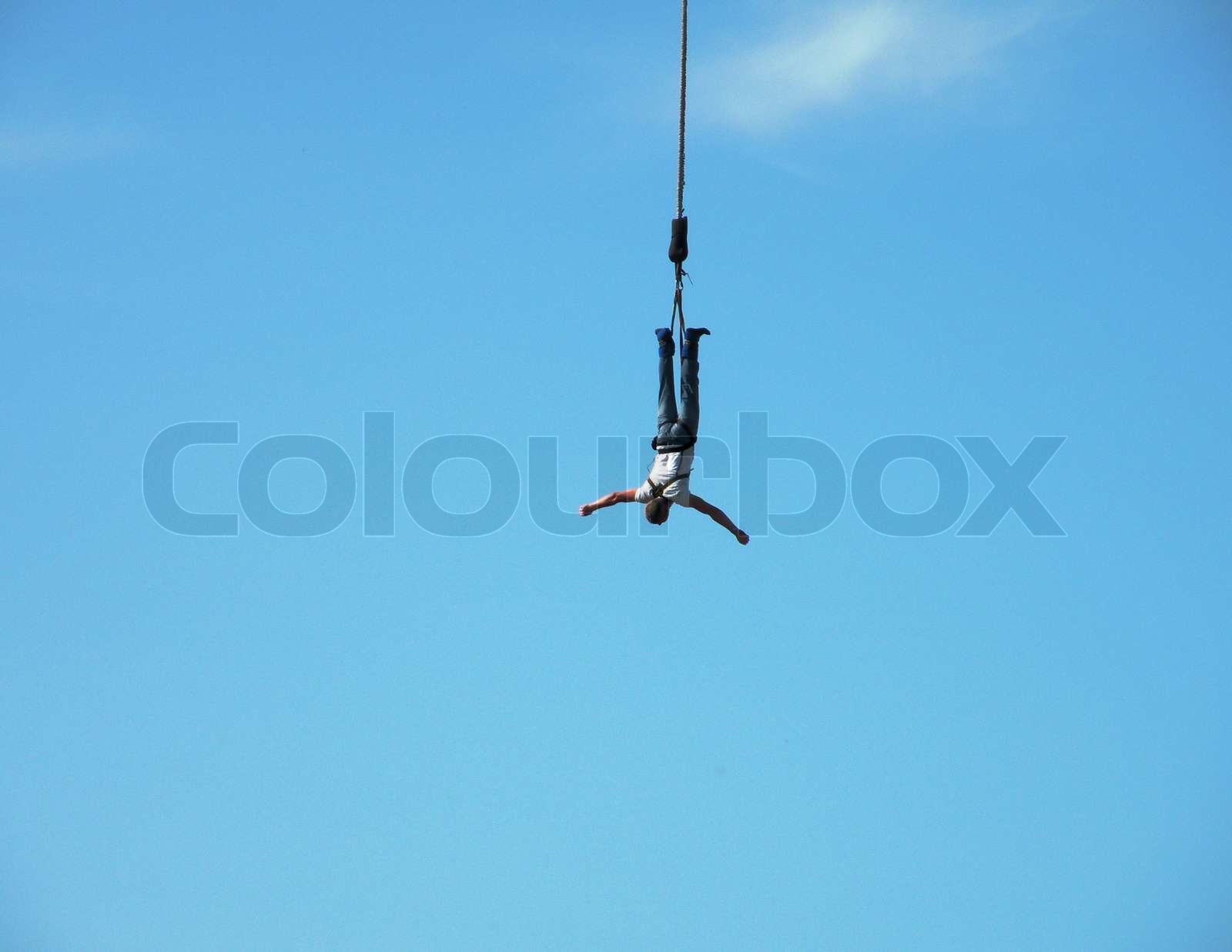 man hanging on bungee rope | Stock image | Colourbox
