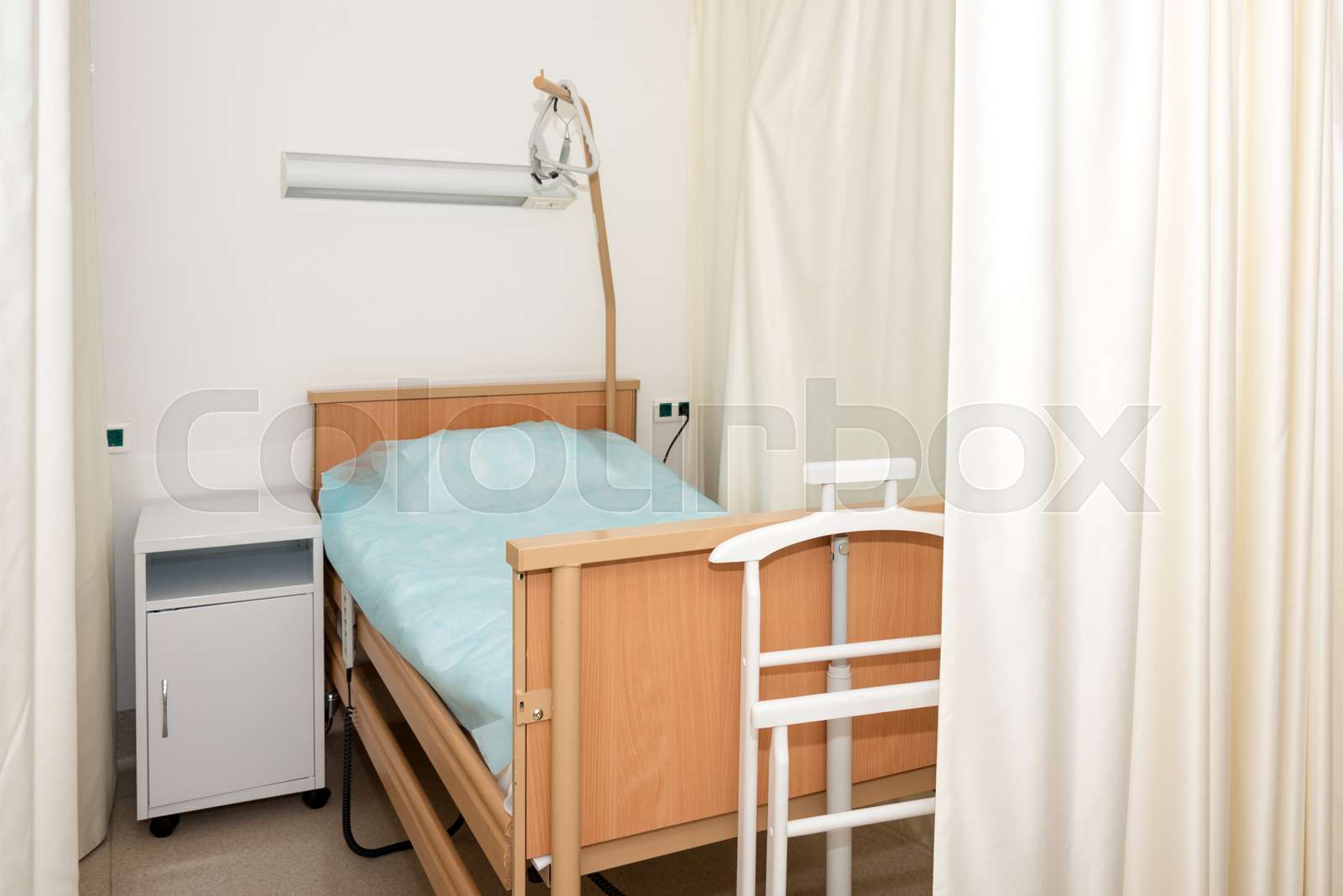 Patient room in clinic. Hospital ward with bed and medical equipment ...