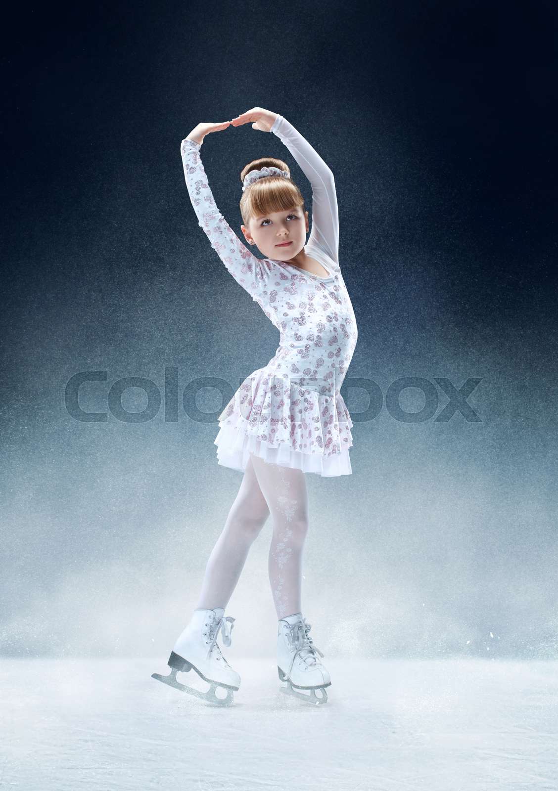 Little girl figure skating at the indoor ice arena. | Stock image ...
