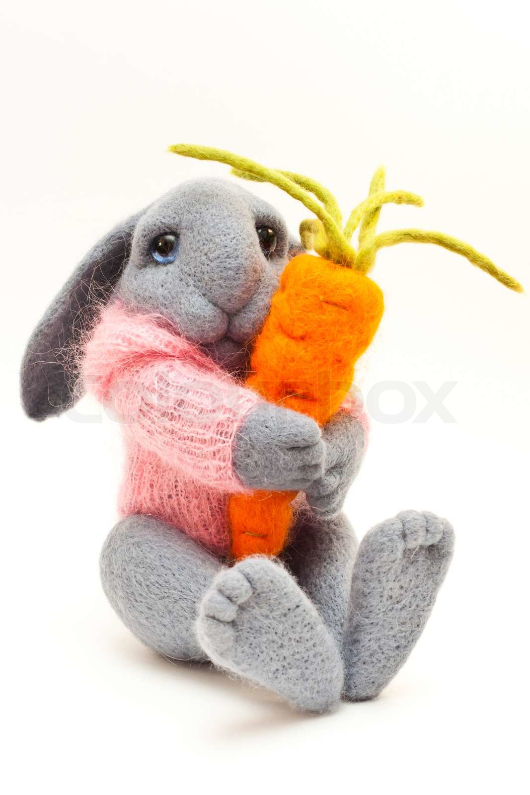 Toy rabbit with carrot | Stock image | Colourbox