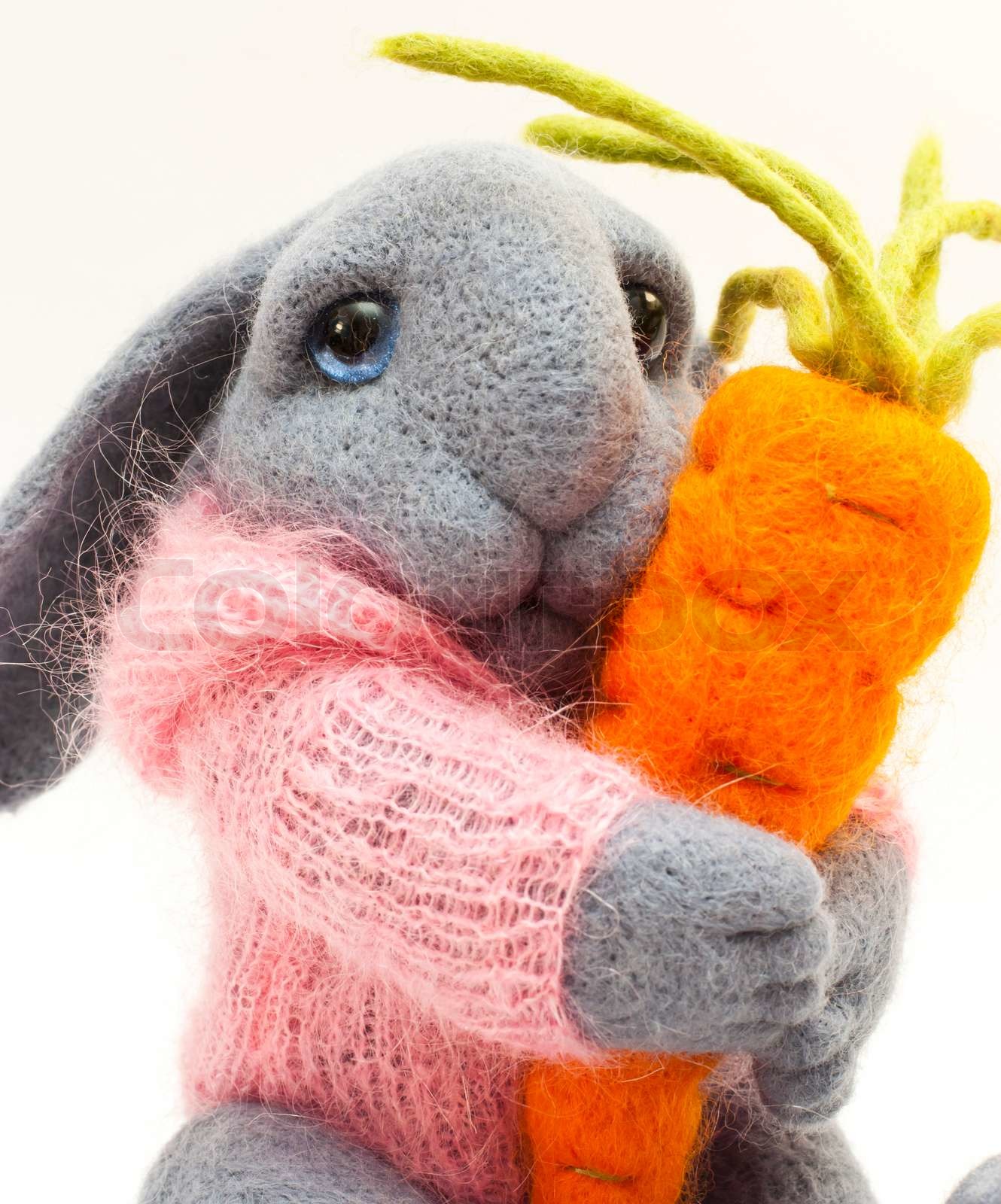 Toy rabbit with carrot | Stock image | Colourbox
