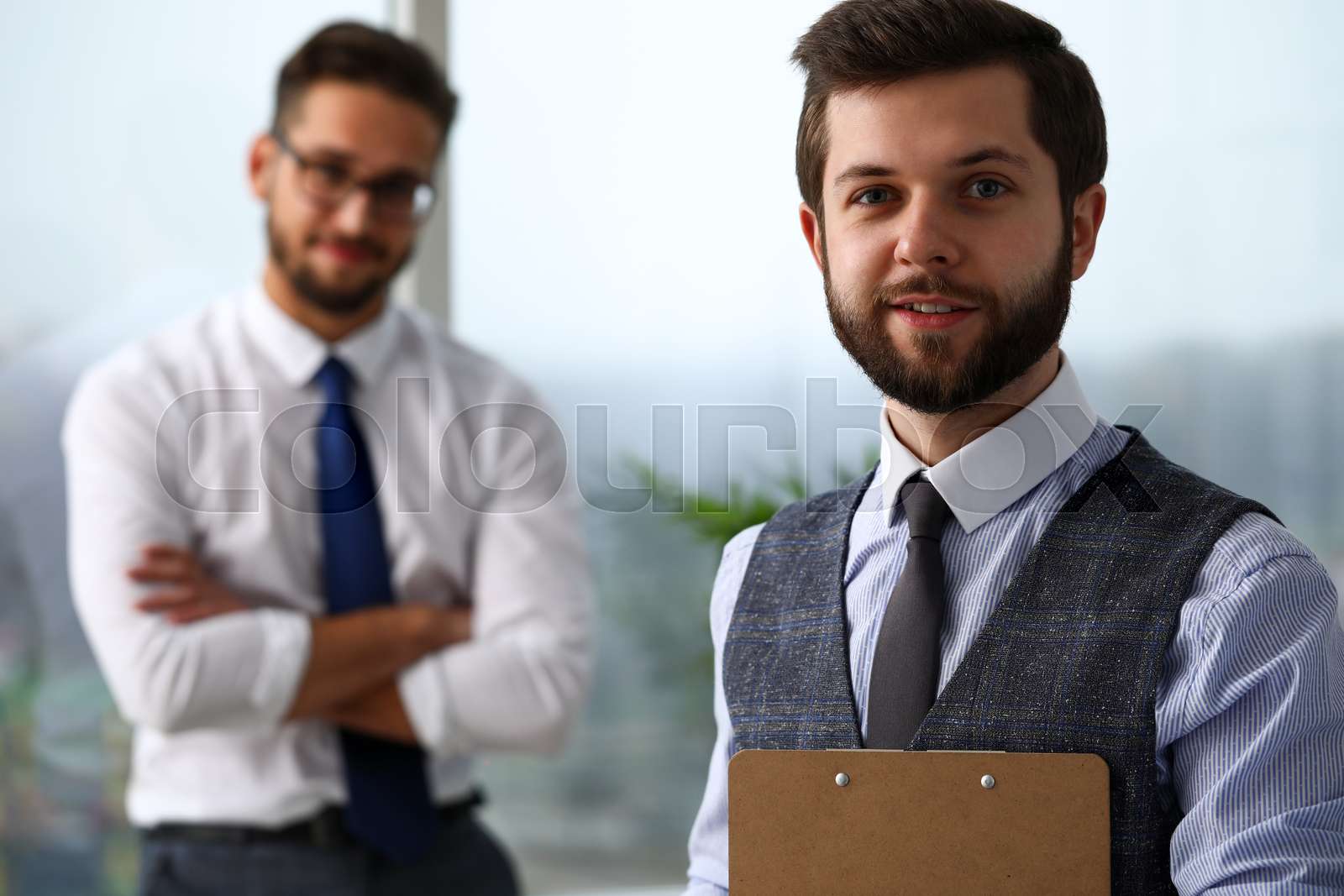 Handsome smiling bearded clerk man at workplace look in camera | Stock ...