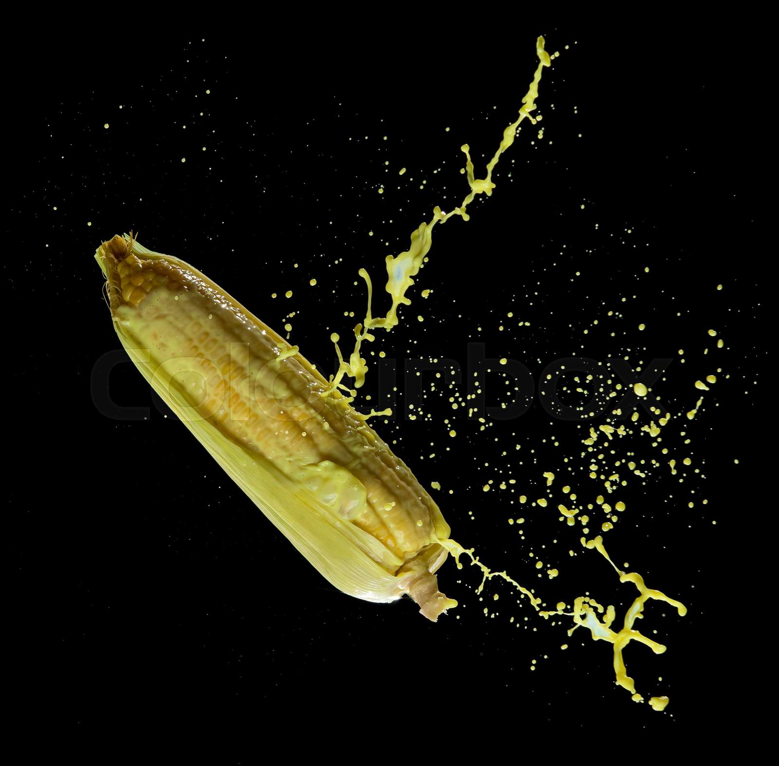 Corn with sweet corn juice (corn milk) splash or explode flying in the ...