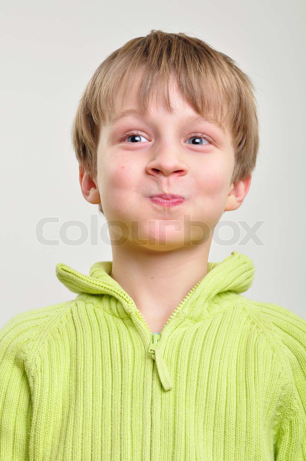 elementary boy making funny faces | Stock image | Colourbox