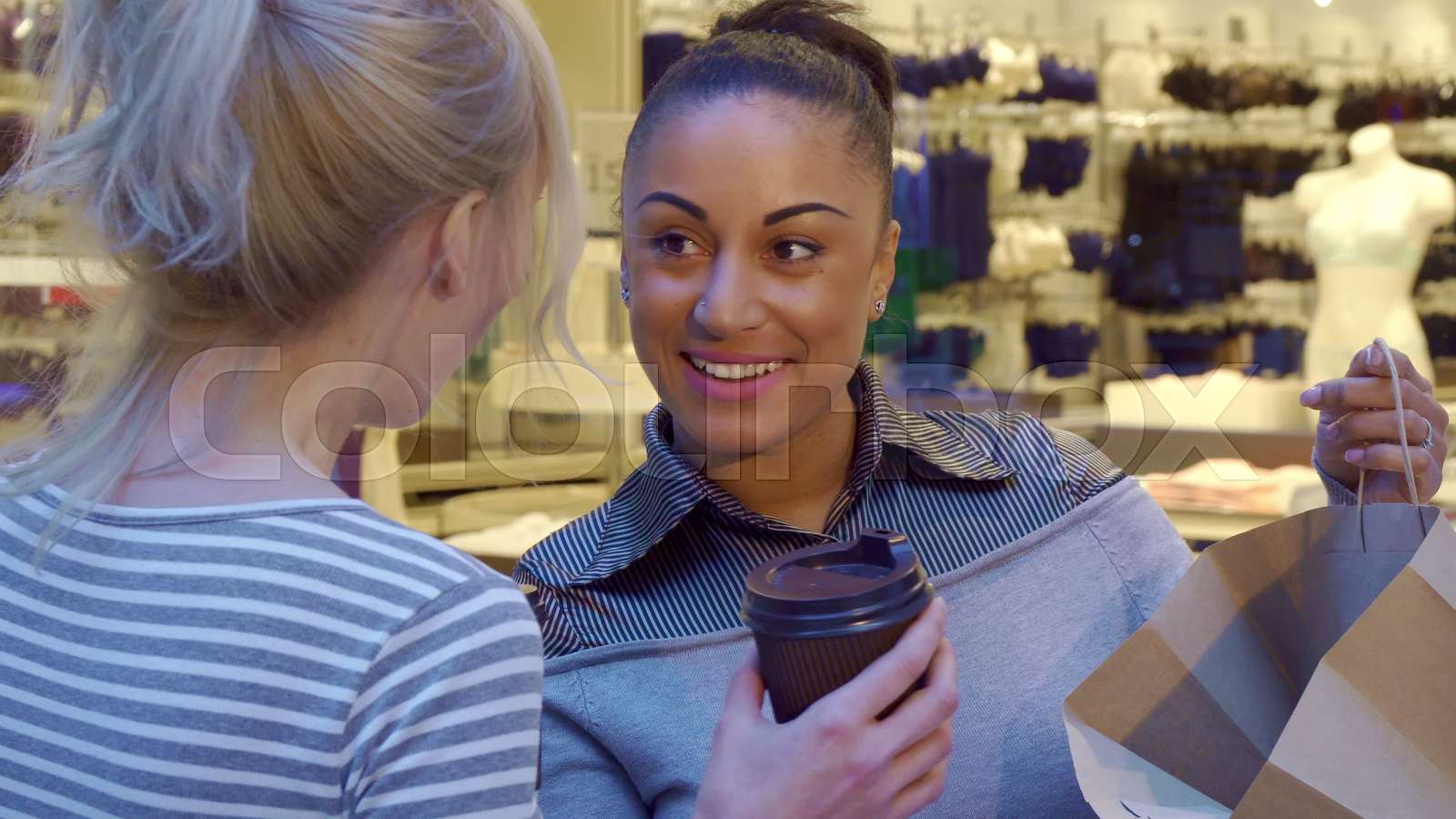 Woman Shows What She Bought To Her Friend Stock Image Colourbox