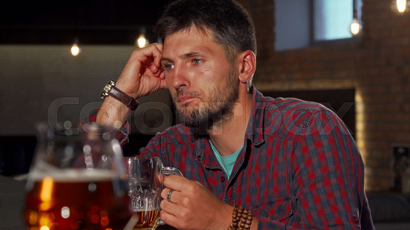 Depressed man drinking alone at the bar | Stock image | Colourbox