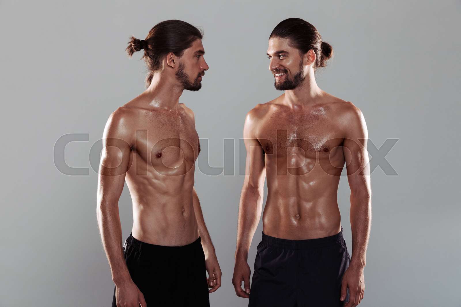 Portrait Of A Two Muscular Shirtless Twin Brothers Stock Image