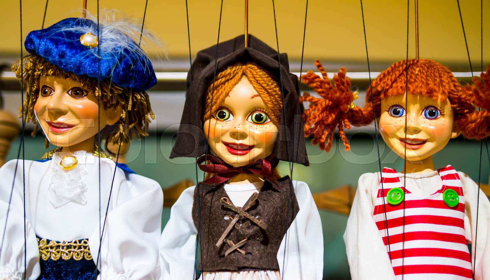 Row of traditional puppets - charming prince, young peasant and ...