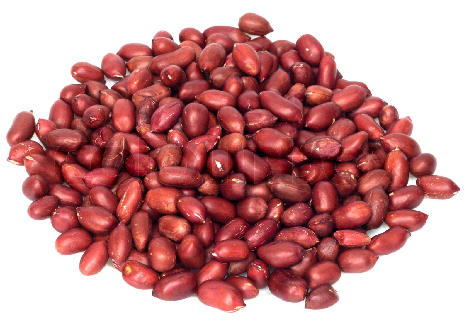 Peanuts with red skin isolated on white | Stock image | Colourbox