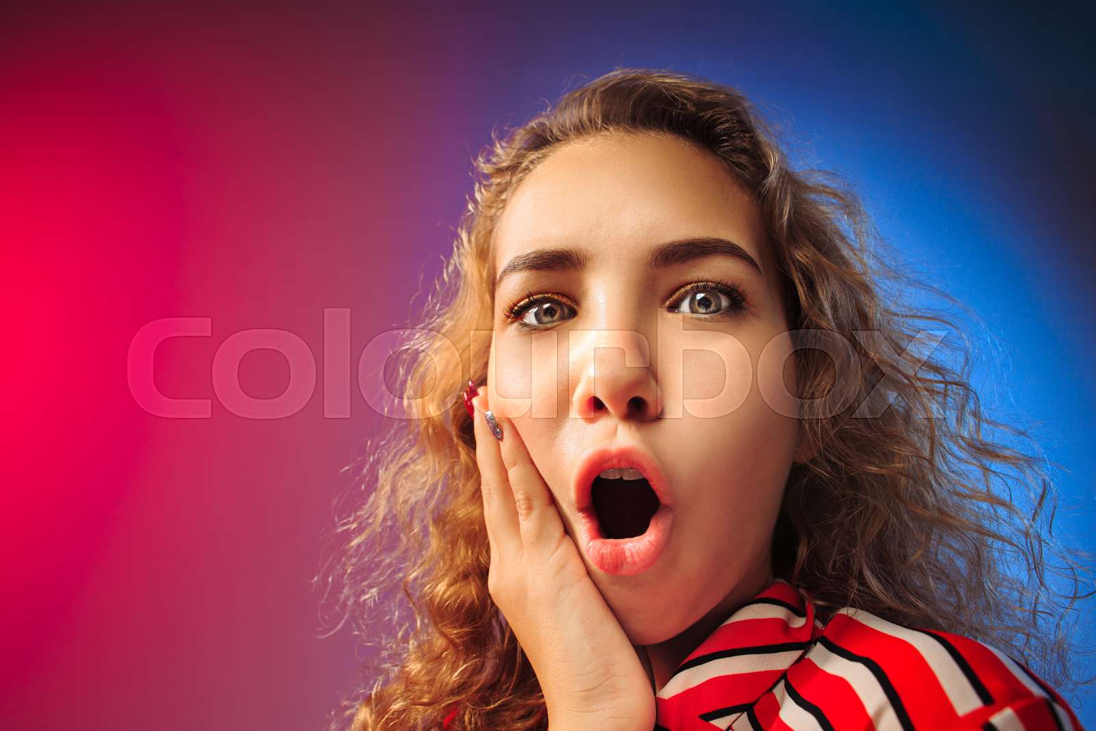 Beautiful woman looking suprised | Stock image | Colourbox