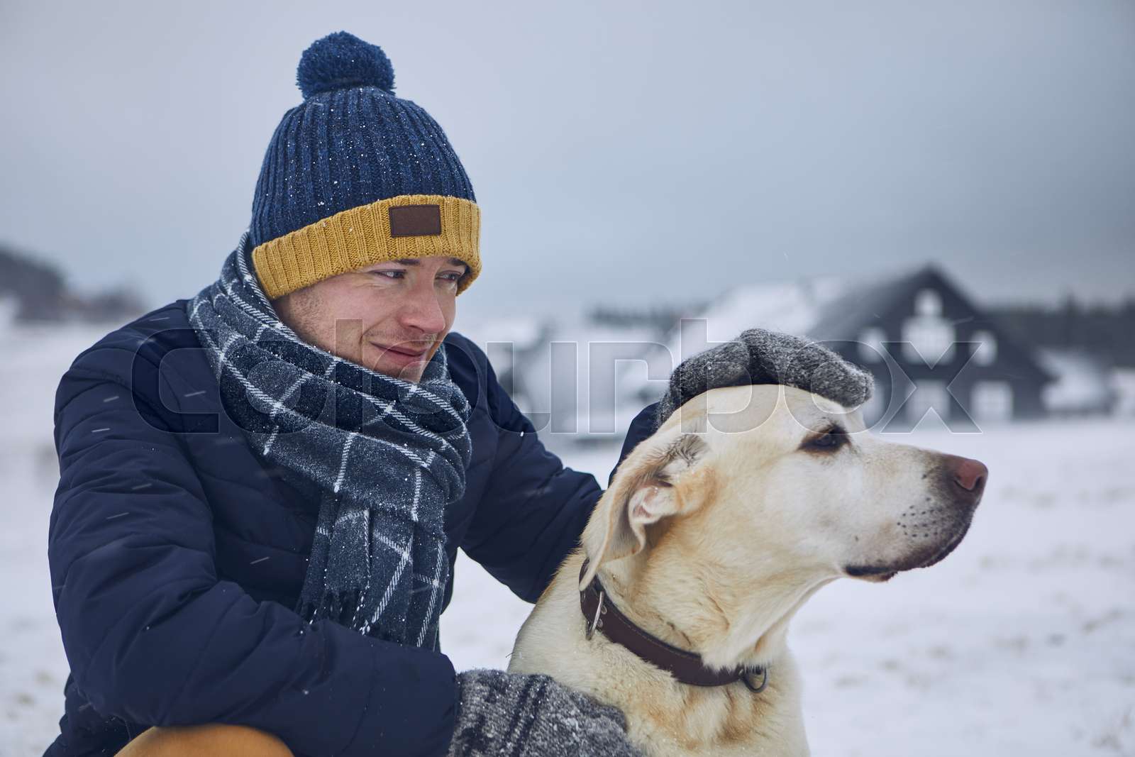 Friendship between pet owner and his dog | Stock image | Colourbox