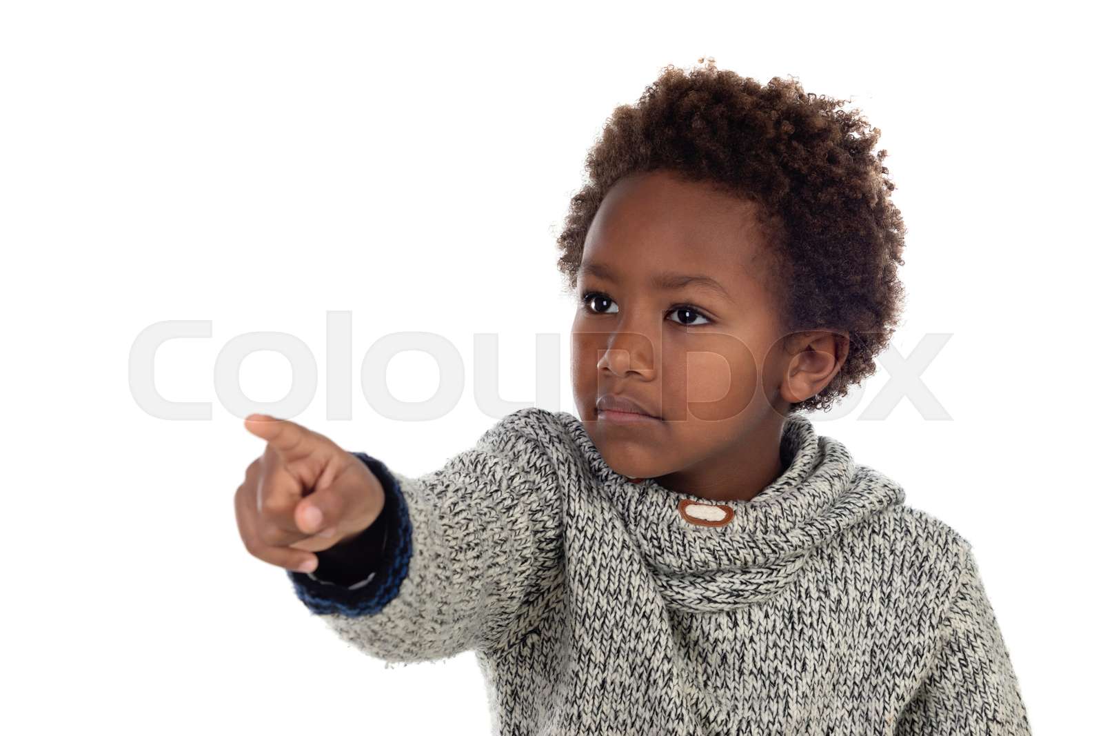 Cute kid pointing with his finger at camera | Stock image | Colourbox