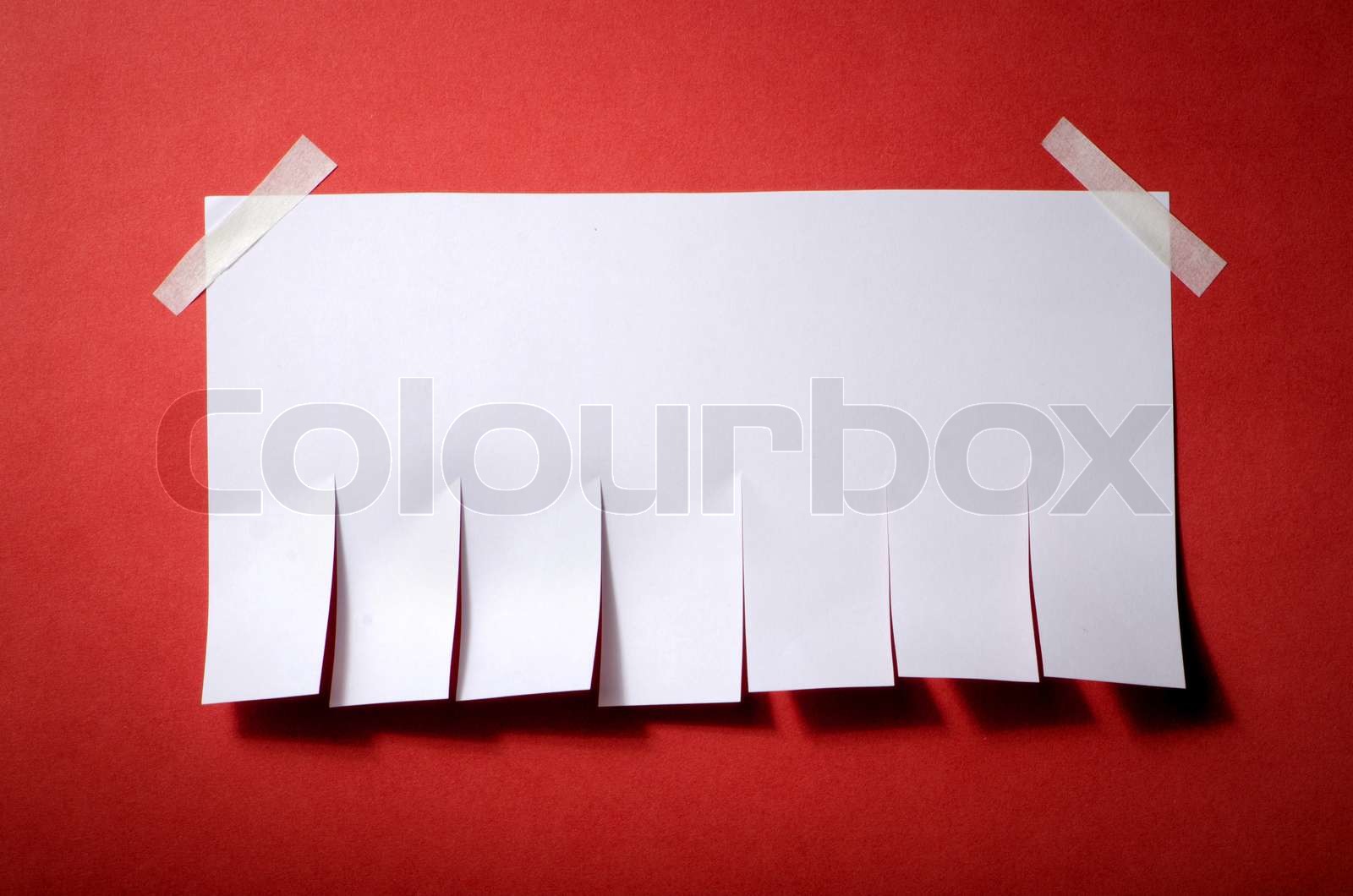 Tear off paper notice on the wall | Stock image | Colourbox
