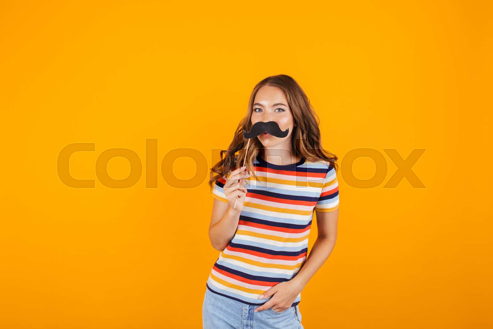Portrait of a smiling young girl standing | Stock image | Colourbox