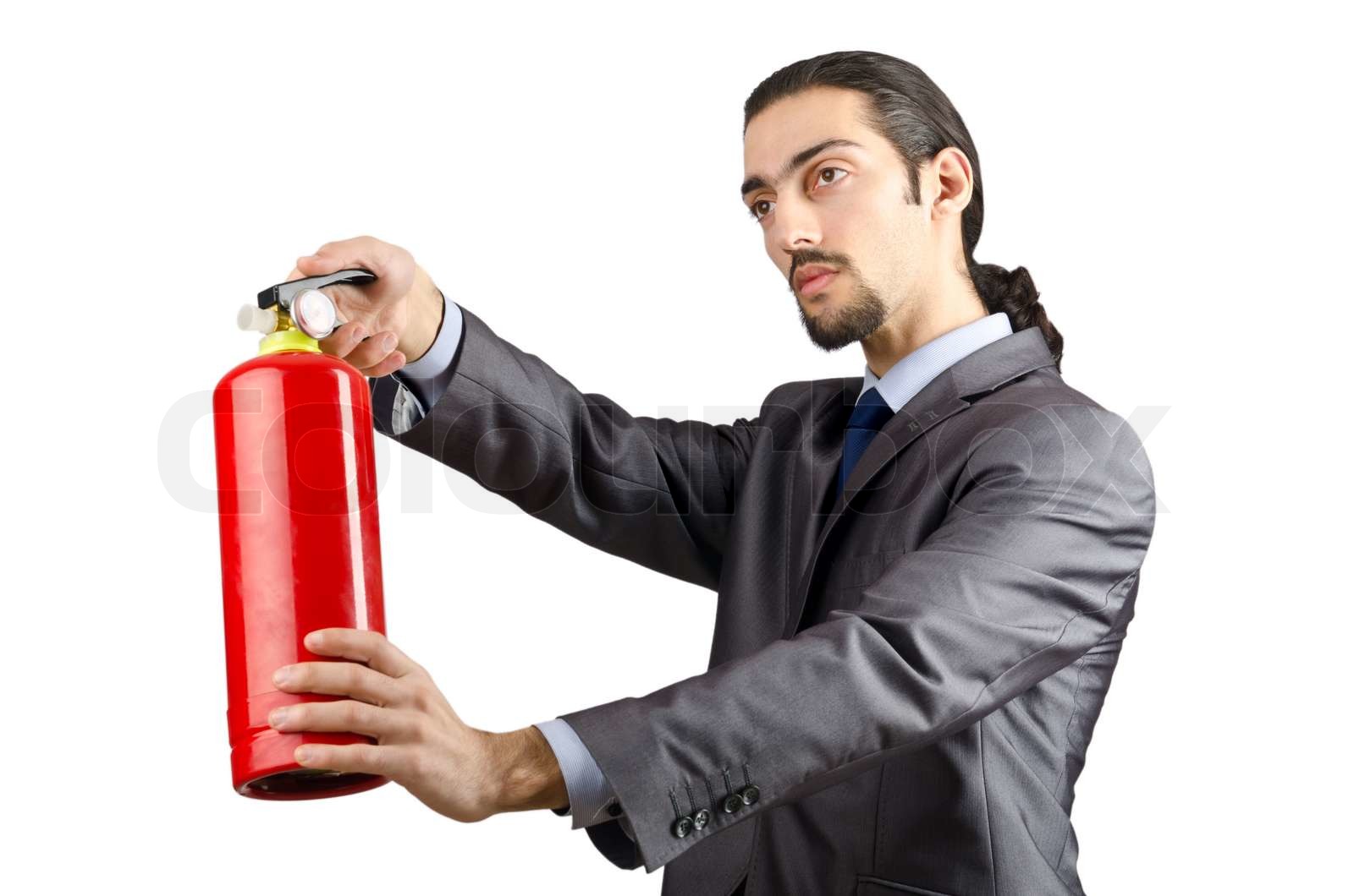 Man with fire extinguisher in firefighting concept | Stock image ...