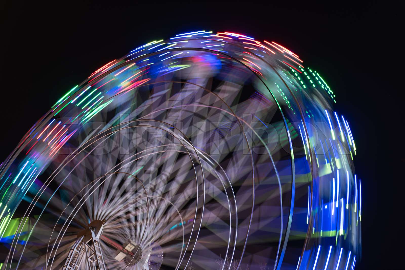 Spinning ferris wheel in motion | Stock image | Colourbox