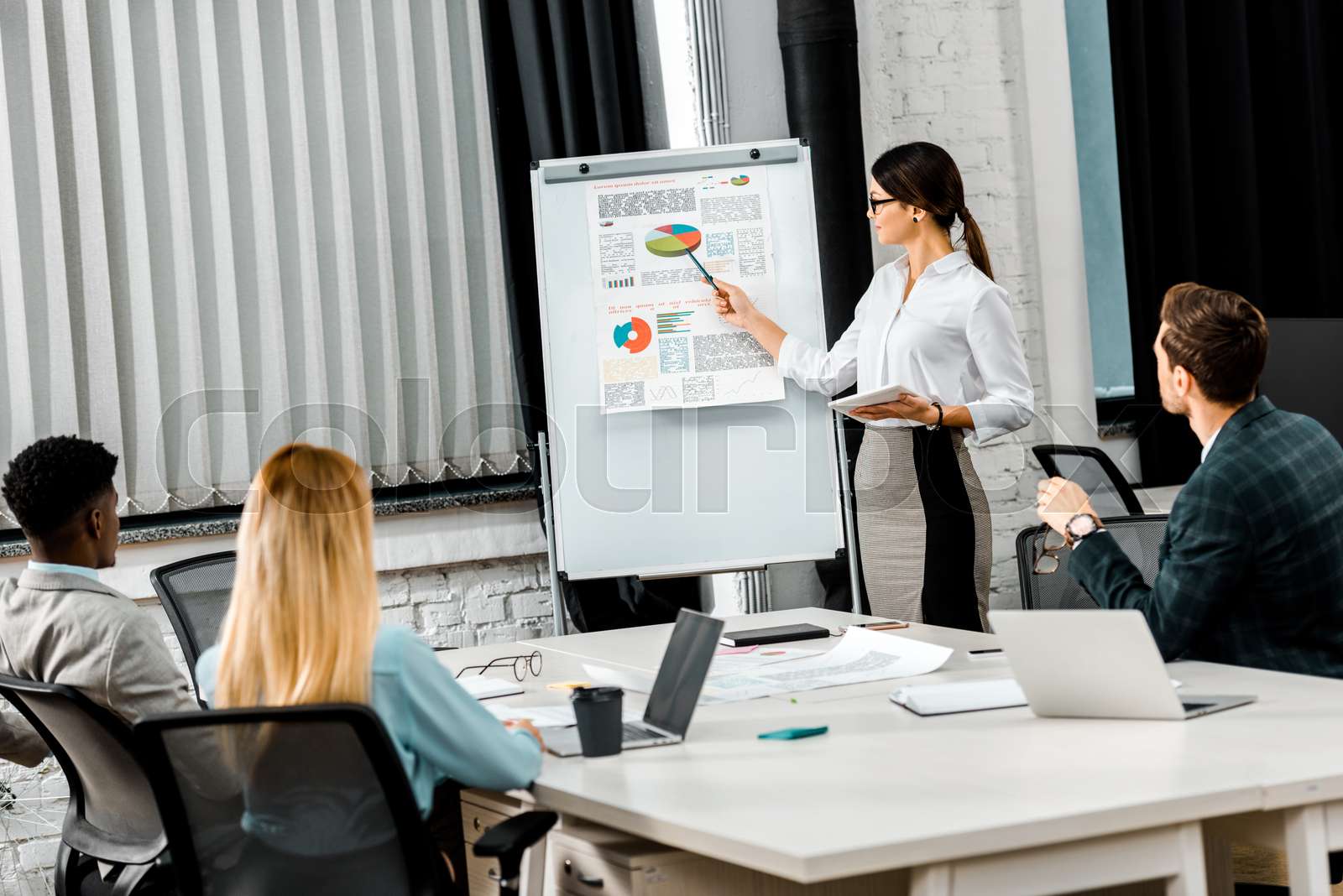 multiethnic businesspeople having discussion during meeting in office ...
