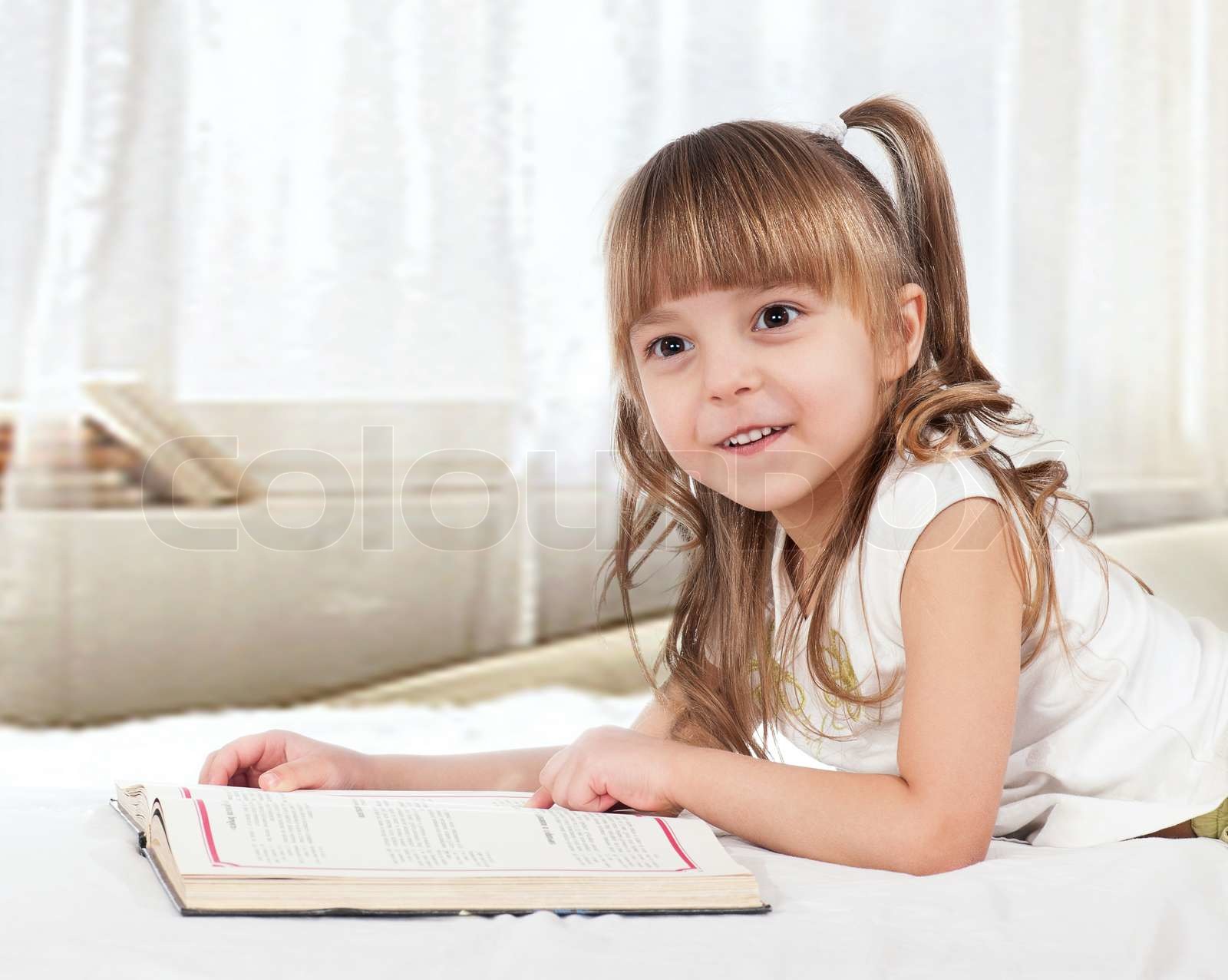 Girl with book | Stock image | Colourbox