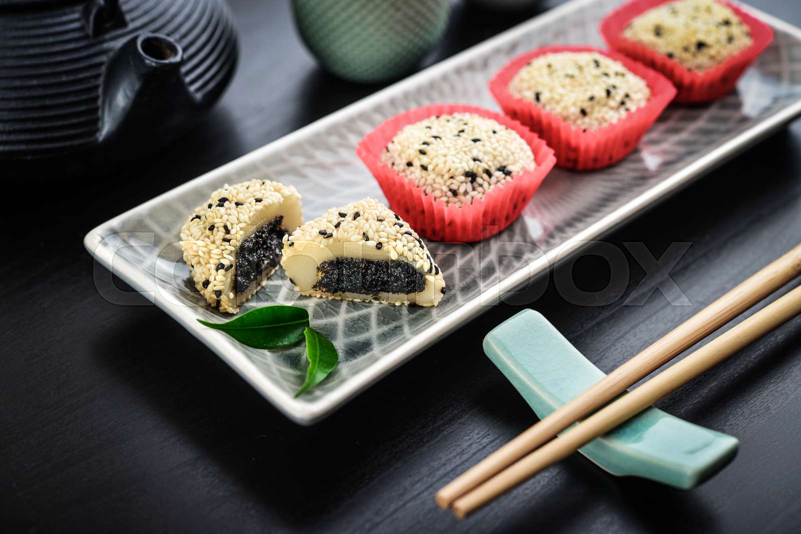 Mochi assortment on plate with chopticks | Stock image | Colourbox