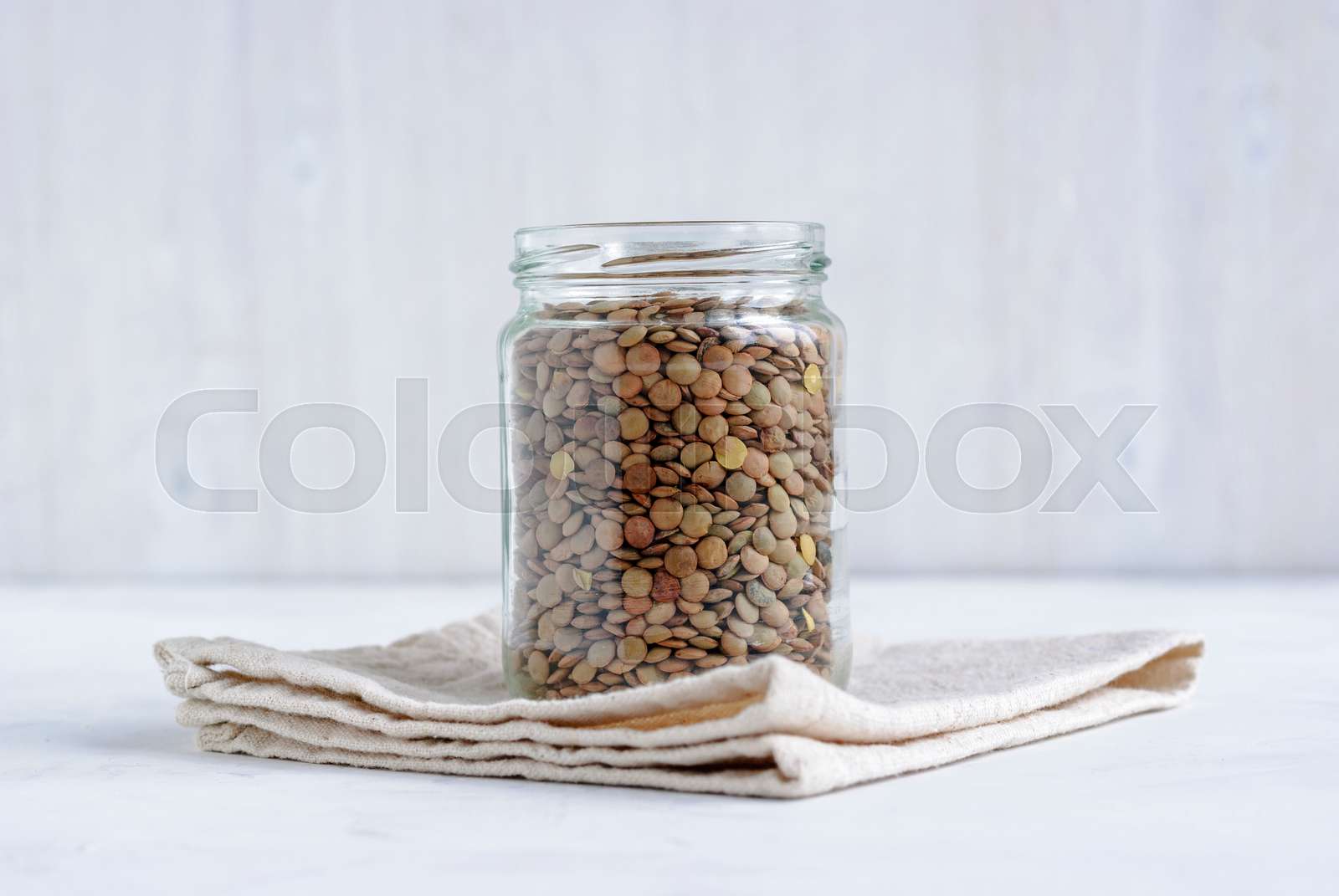 Dried green lentils stored in a glass jar | Stock image | Colourbox