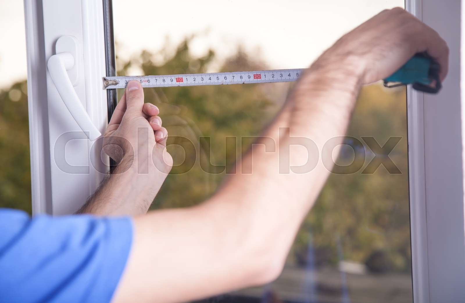 Man measuring window. Installing new window in house | Stock image ...