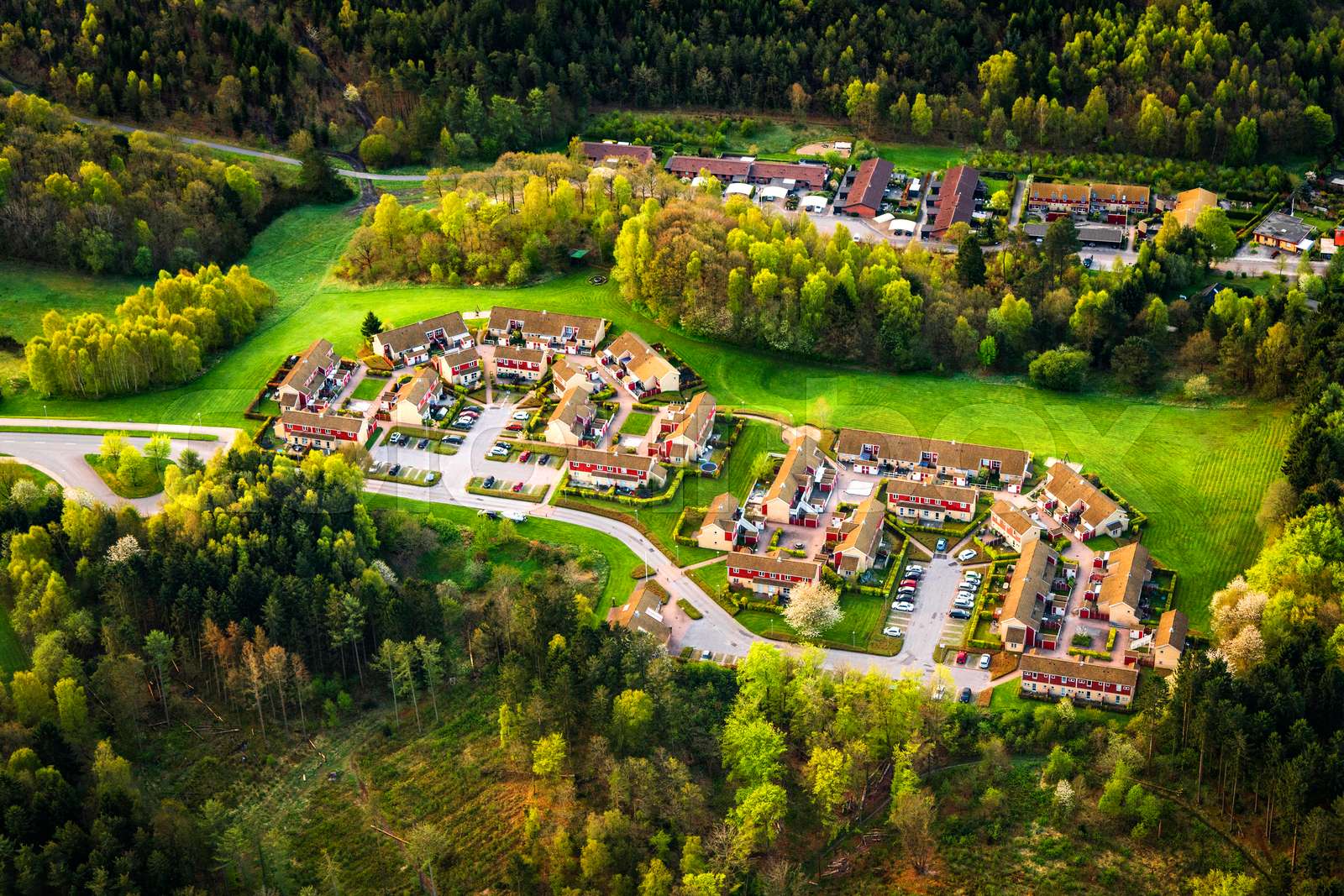 Small village seen from above surrounded by forest | Stock image ...