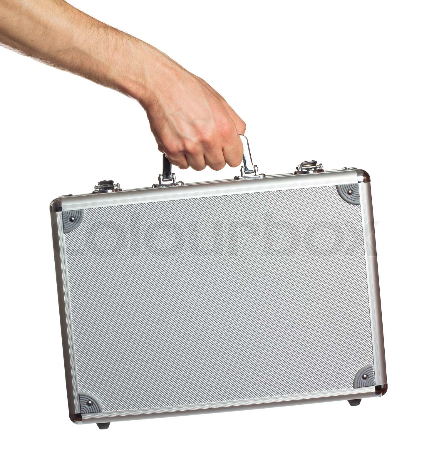 Silver metal briefcase in hand | Stock image | Colourbox