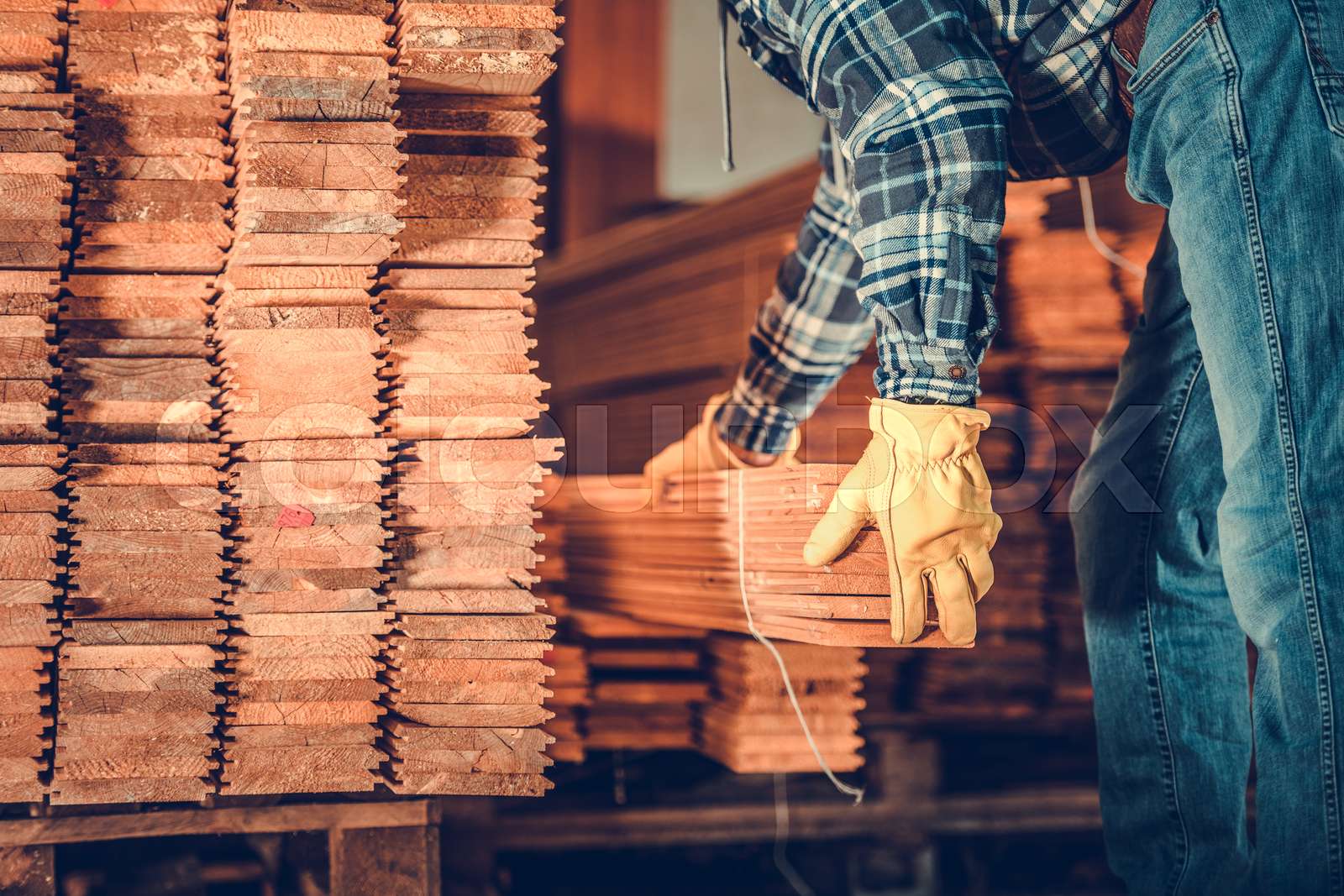 Pile of Planks and Contractor | Stock image | Colourbox