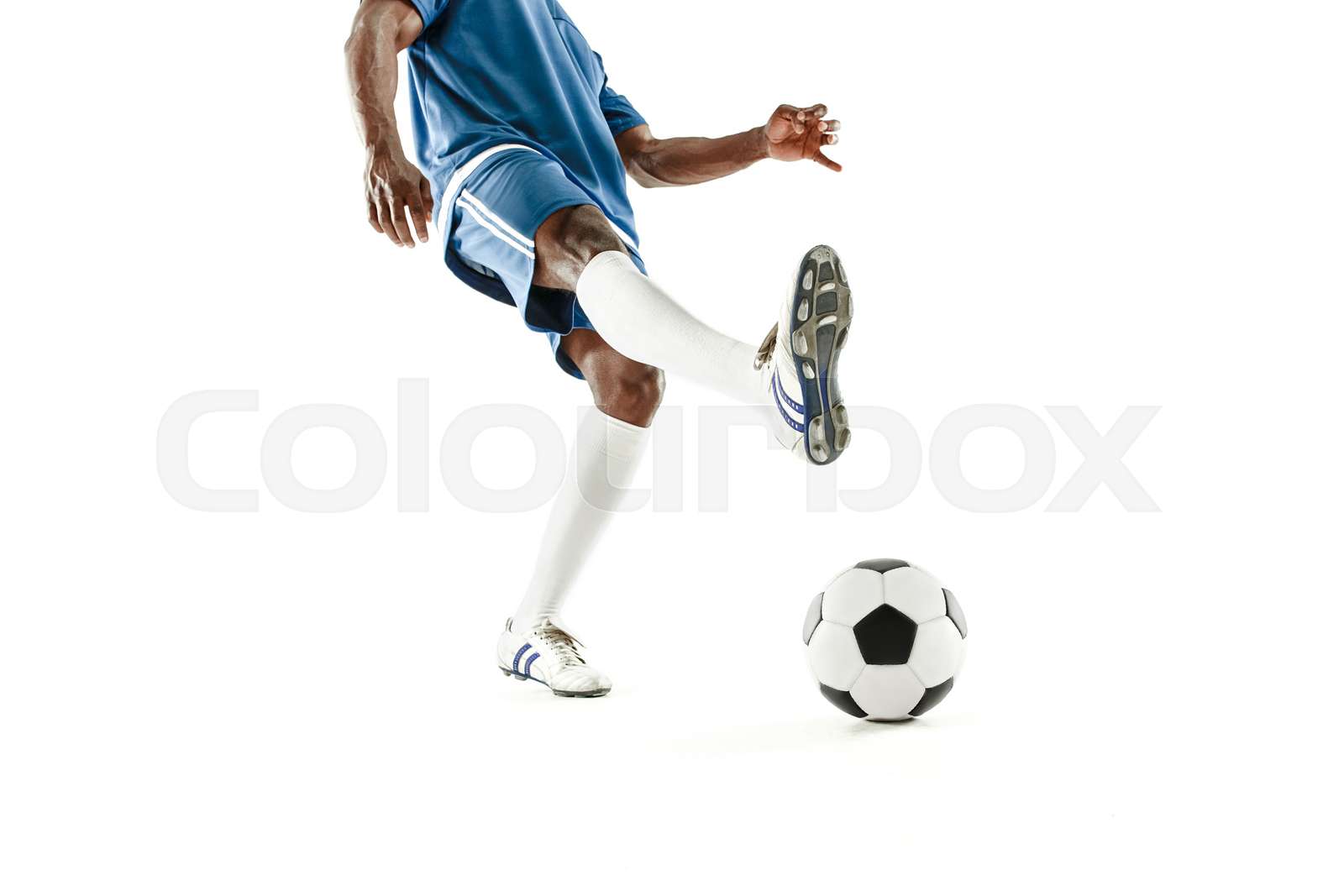 legs of soccer player close-up isolated on white | Stock image | Colourbox