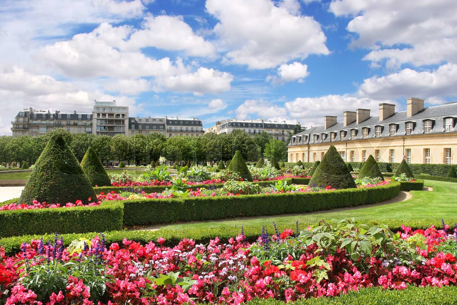 View on beautiful park at Les Invalides with red flowers and green ...