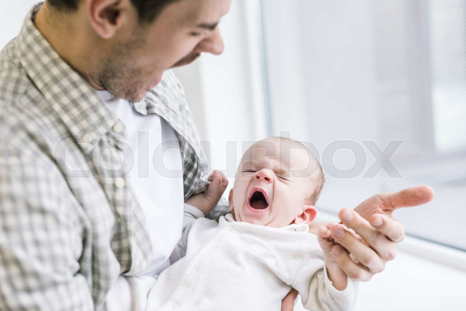 young father copying son while he yawning at home | Stock image | Colourbox