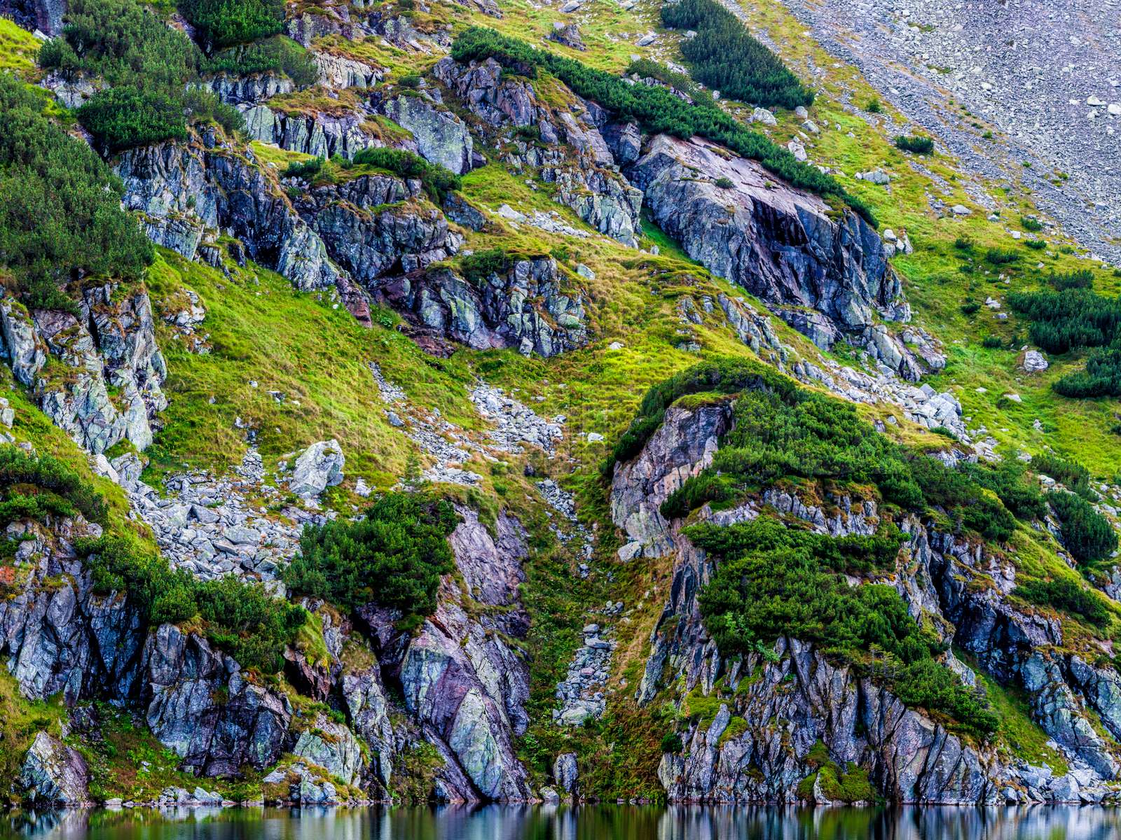 Mountain slope with small lake at botom | Stock image | Colourbox